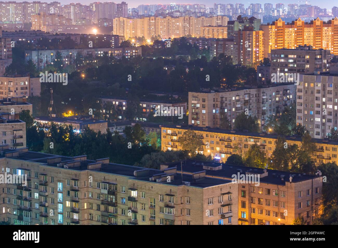 Night colorful windows lights of the high-rise residential building in ...