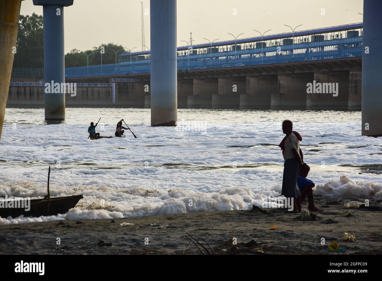 New Delhi, India. 26th Aug, 2021. Fisherman seen at work in the heavily ...