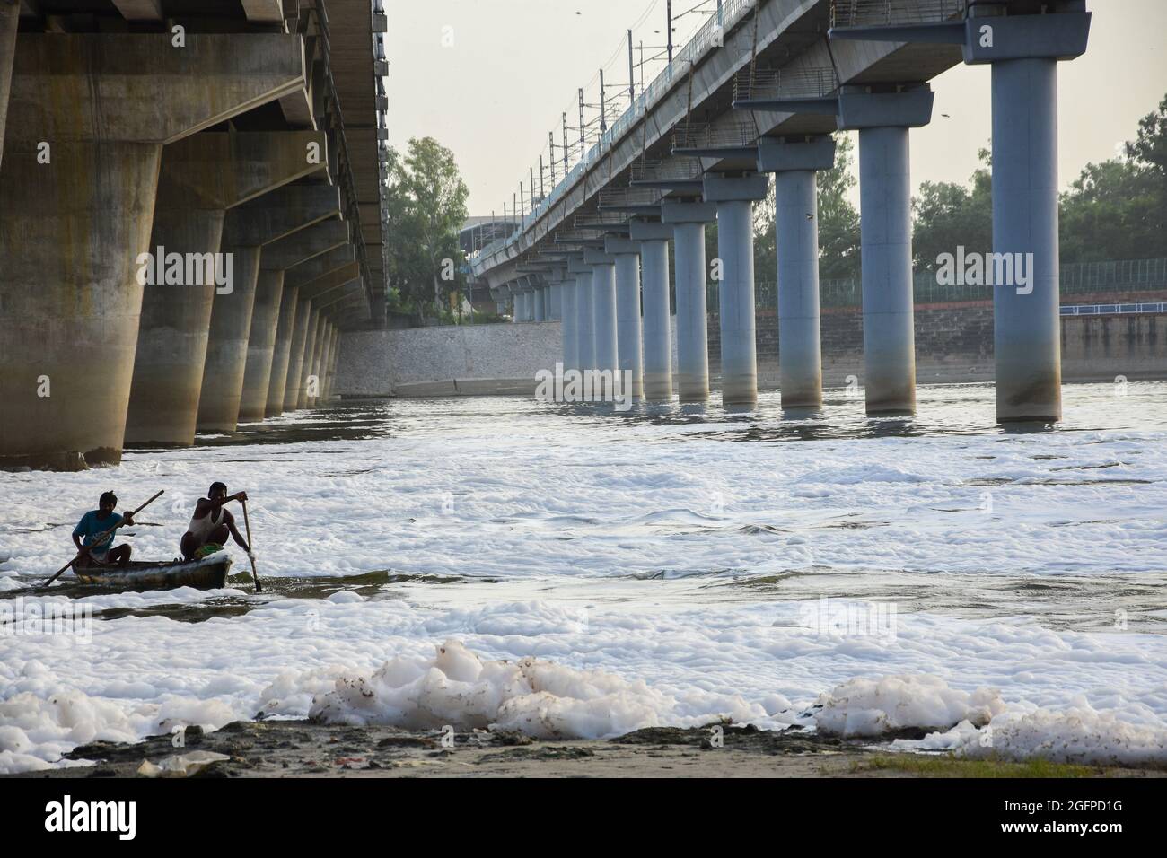 New Delhi, India. 26th Aug, 2021. Fisherman seen at work in the heavily ...