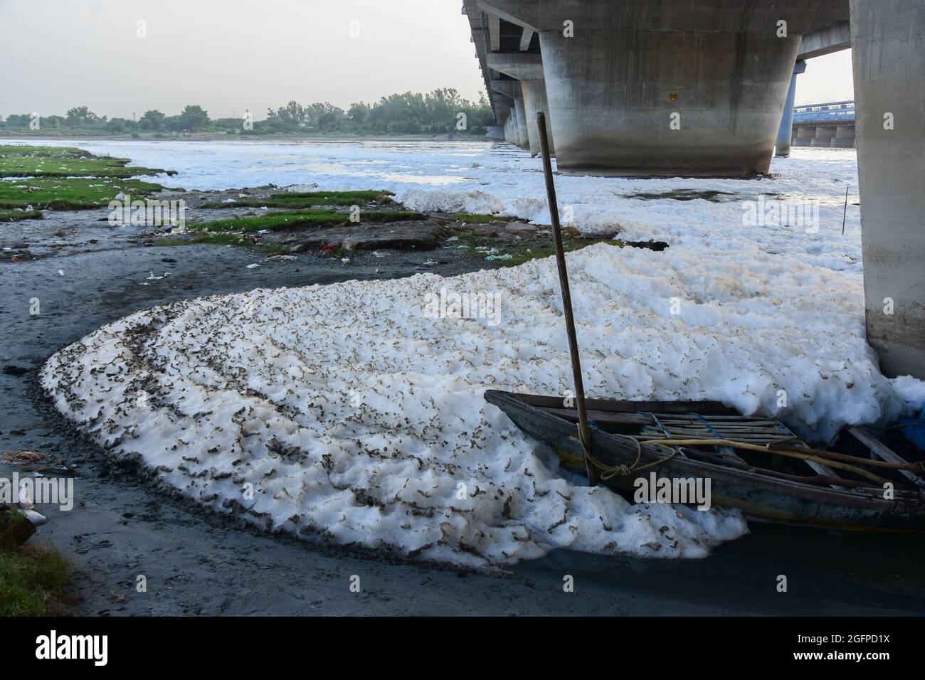 New Delhi, India. 26th Aug, 2021. A boat seen on the banks with the ...