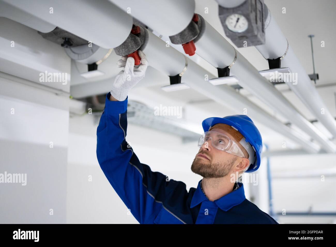 PVC Water Pipe Inspection By Construction Worker Stock Photo - Alamy