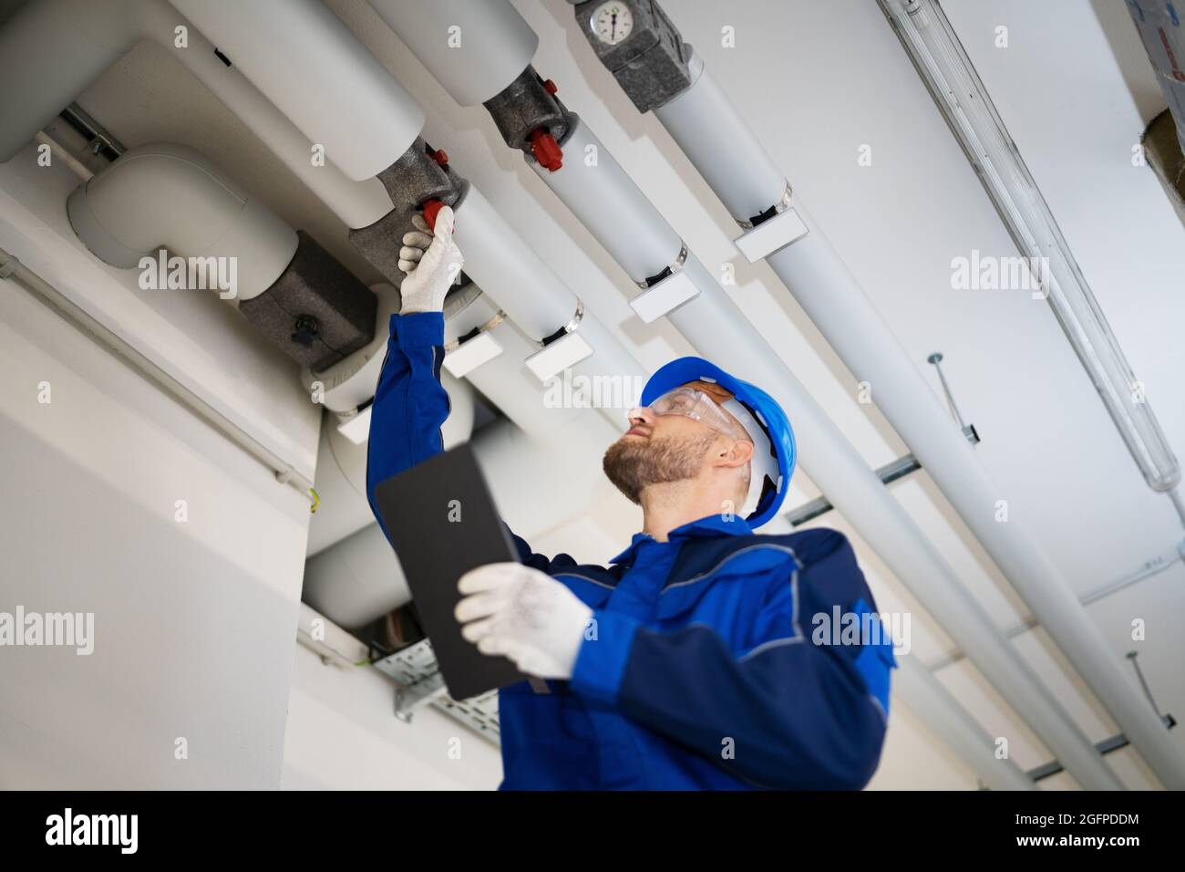 PVC Water Pipe Inspection By Construction Worker Stock Photo - Alamy