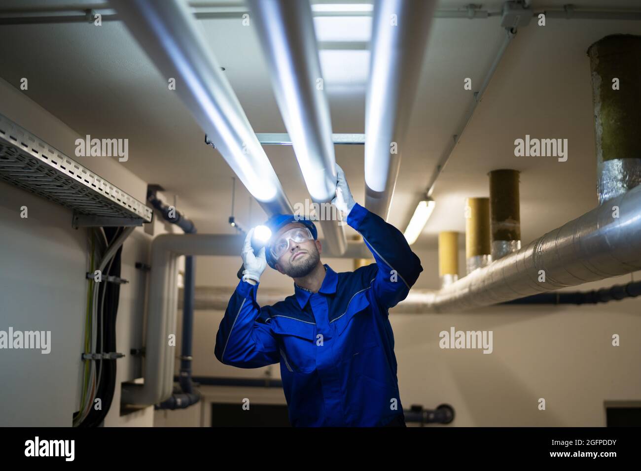 PVC Water Pipe Inspection By Construction Worker Stock Photo - Alamy