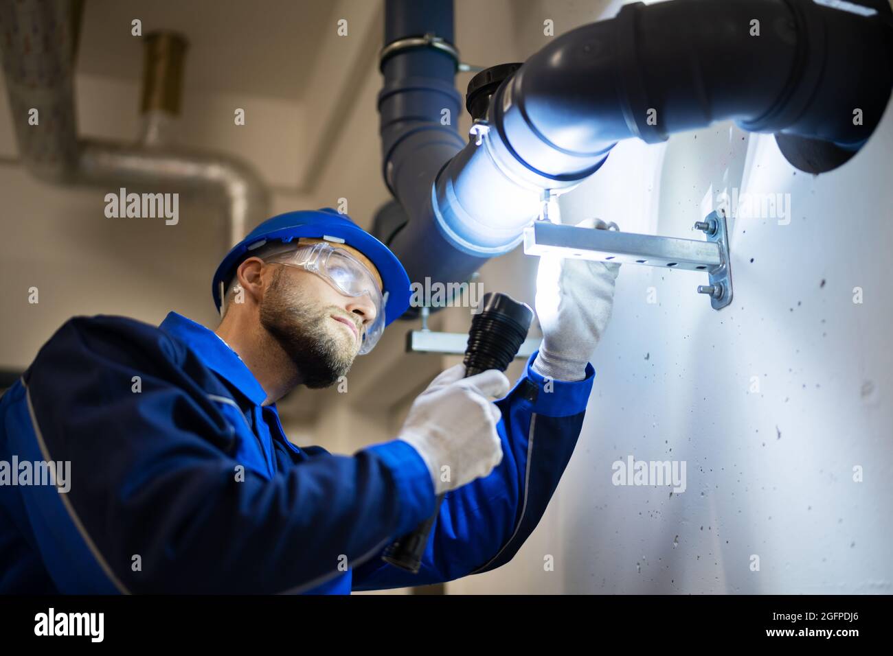 PVC Water Pipe Inspection By Construction Worker Stock Photo - Alamy