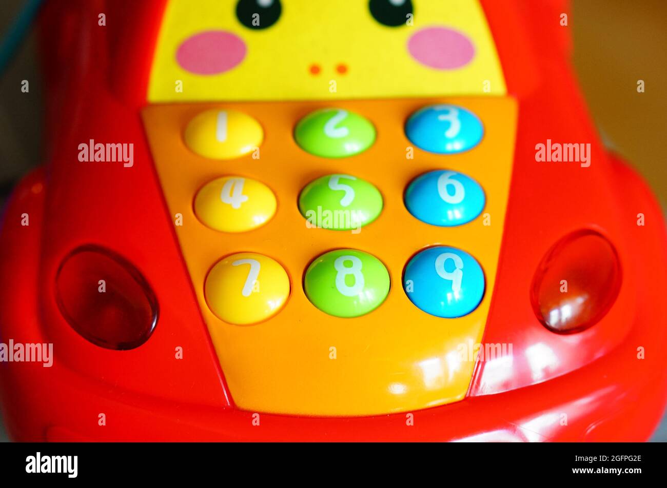 Close-up shot of a toy telephone with colorful numbers Stock Photo - Alamy