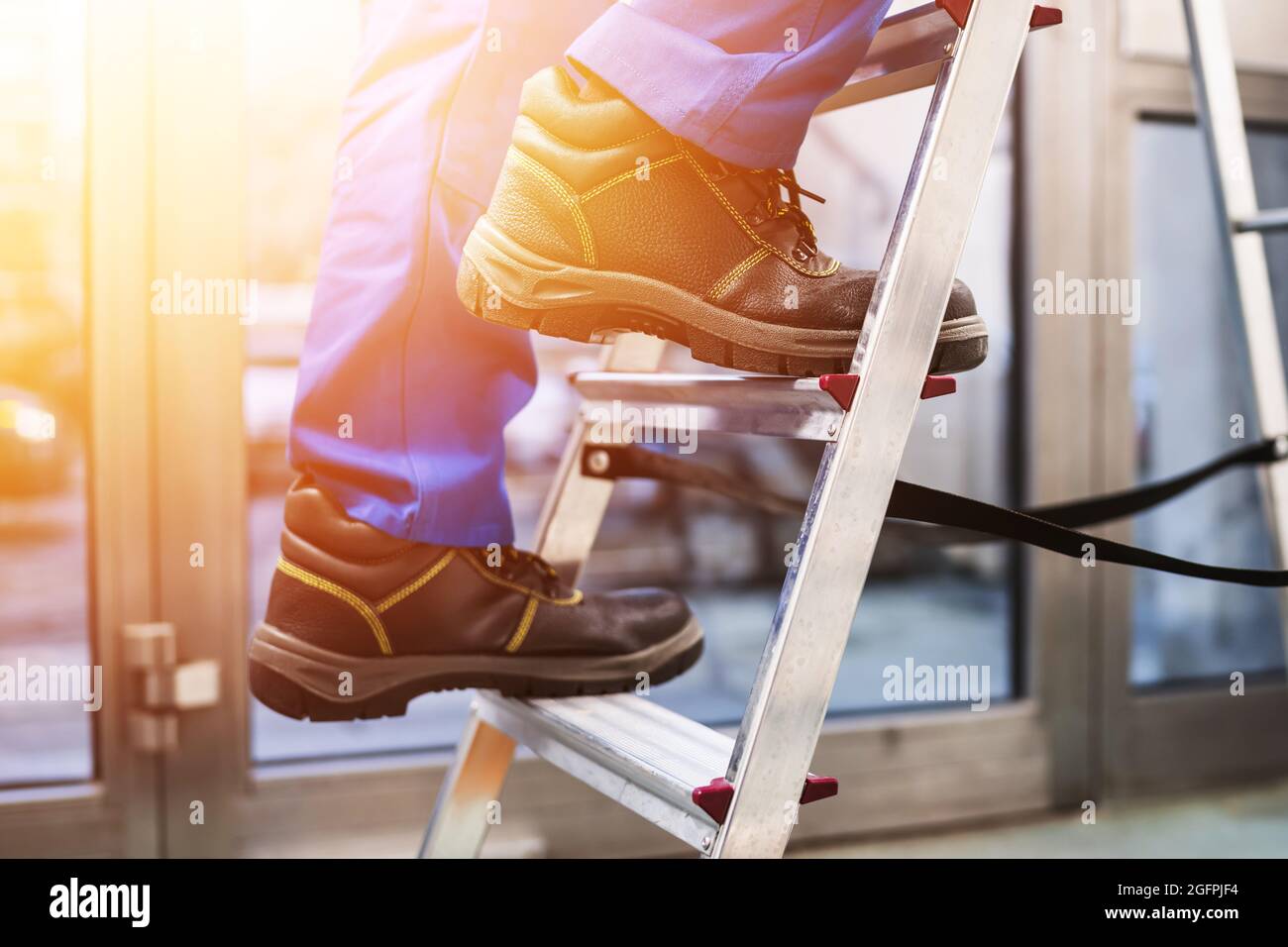 Step Ladder Safety. Climbing Man Foot And Shoe Stock Photo - Alamy