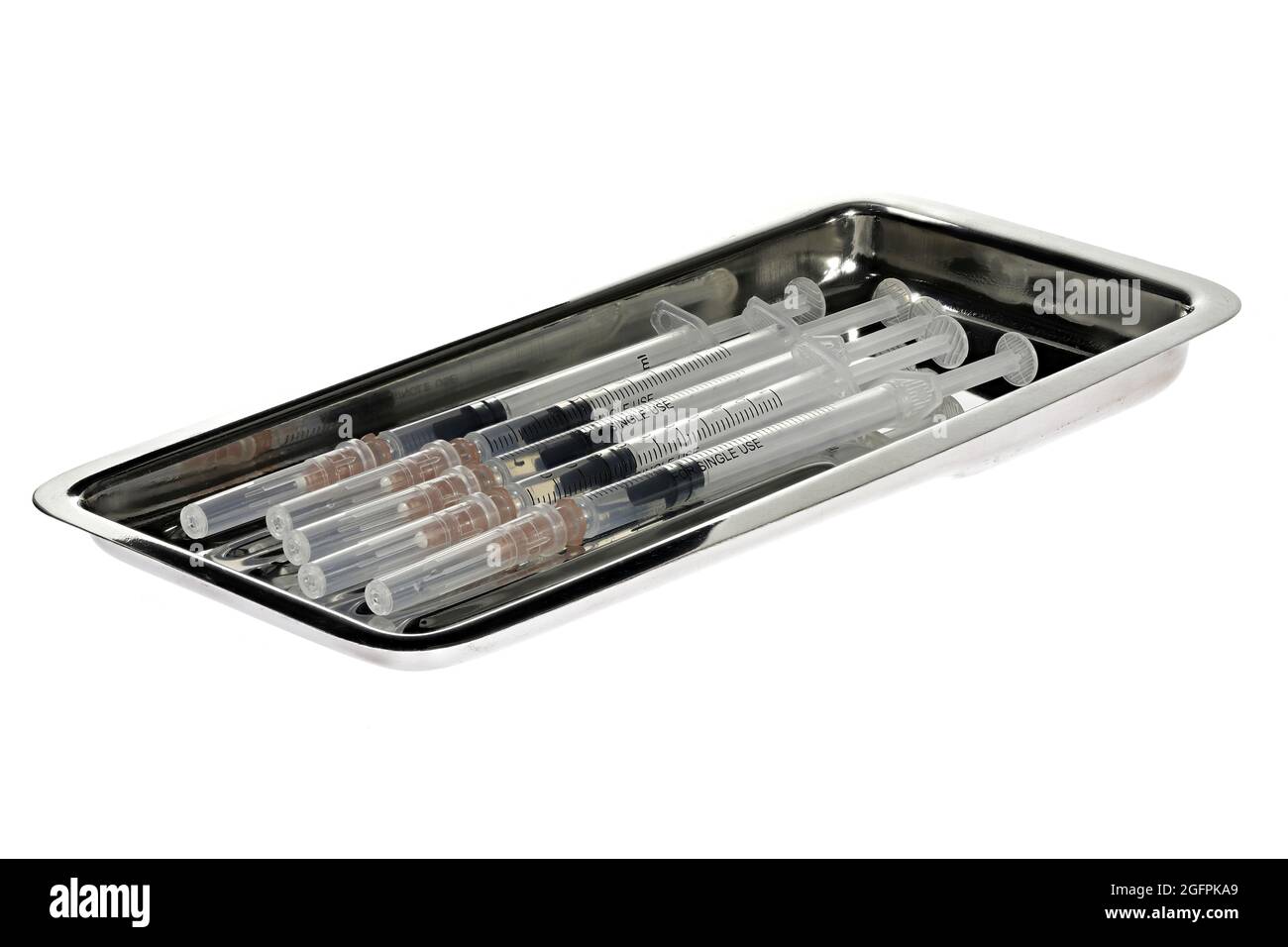 syringes on stainless steel tray isolated on white background Stock ...
