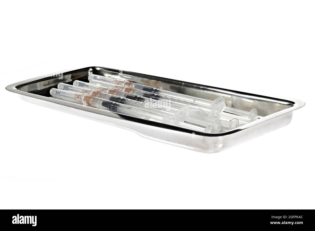 syringes on stainless steel tray isolated on white background Stock ...