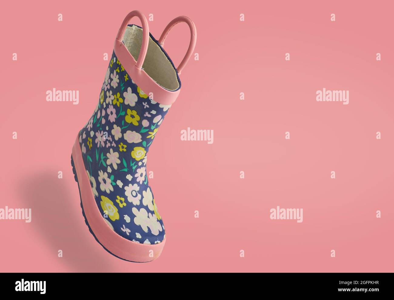 isolated kids toddler rain rubber boot on a pink background 3d view ...