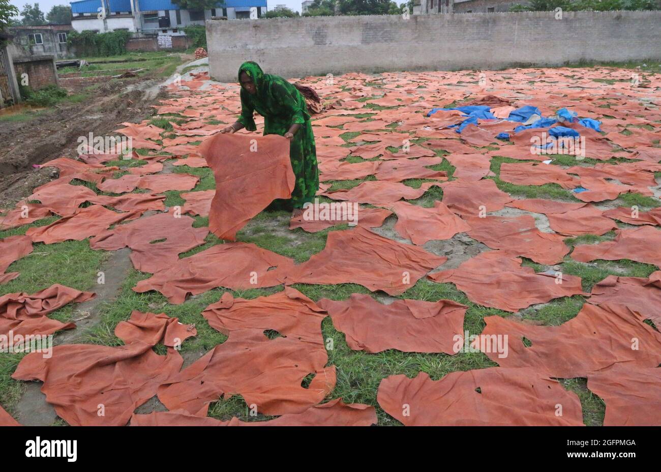 Non Exclusive: DHAKA, BANGLADESH - AUGUST 26: A worker woman of a ...