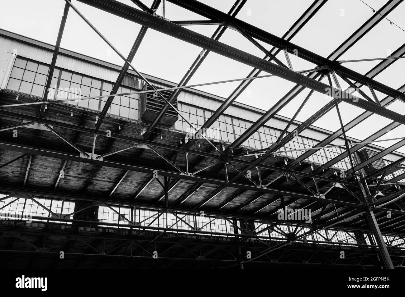 Steel girders and factory windows under open sky Stock Photo - Alamy
