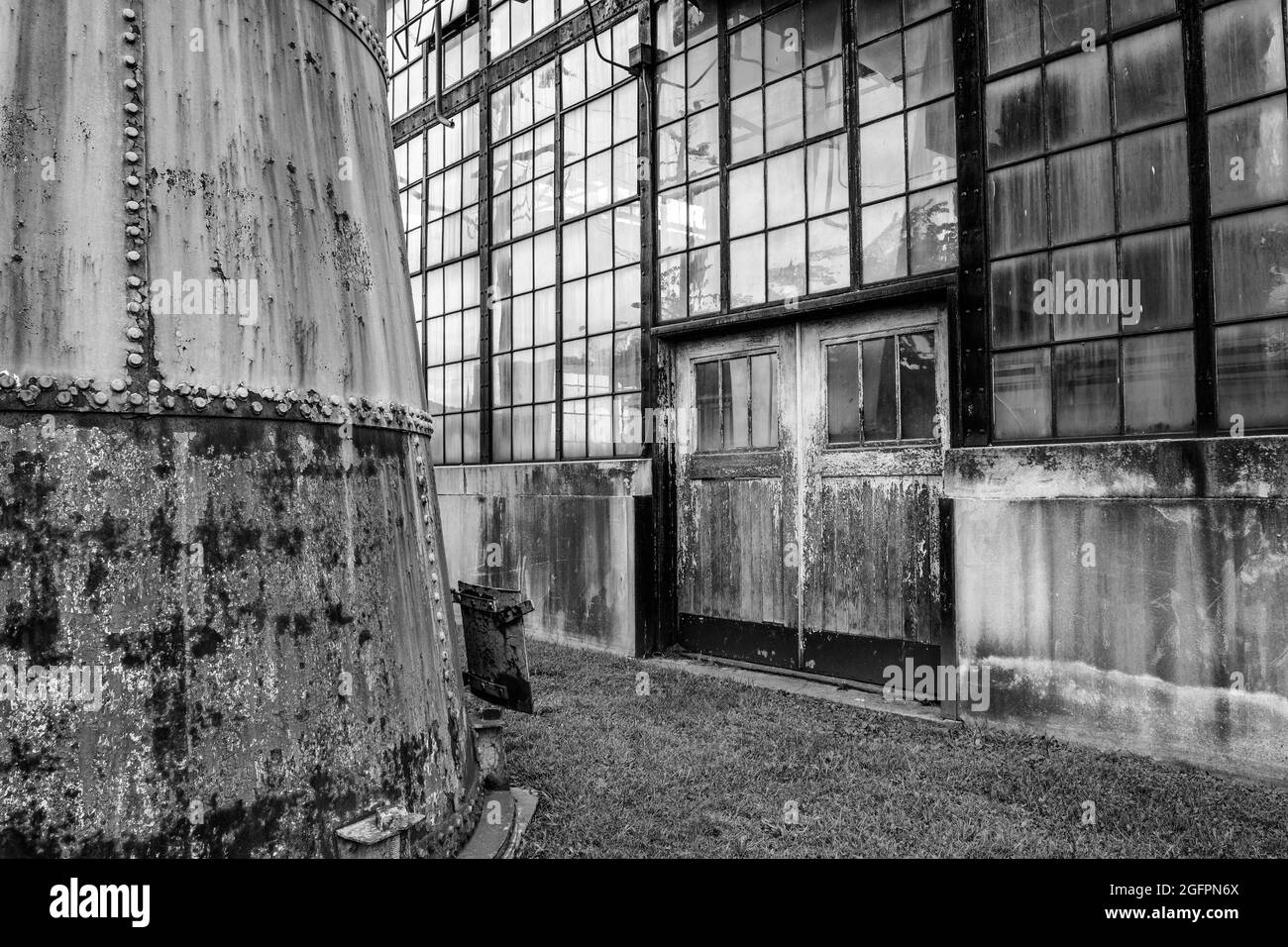 Industrial exterior with doors and windows from old, unused factory ...