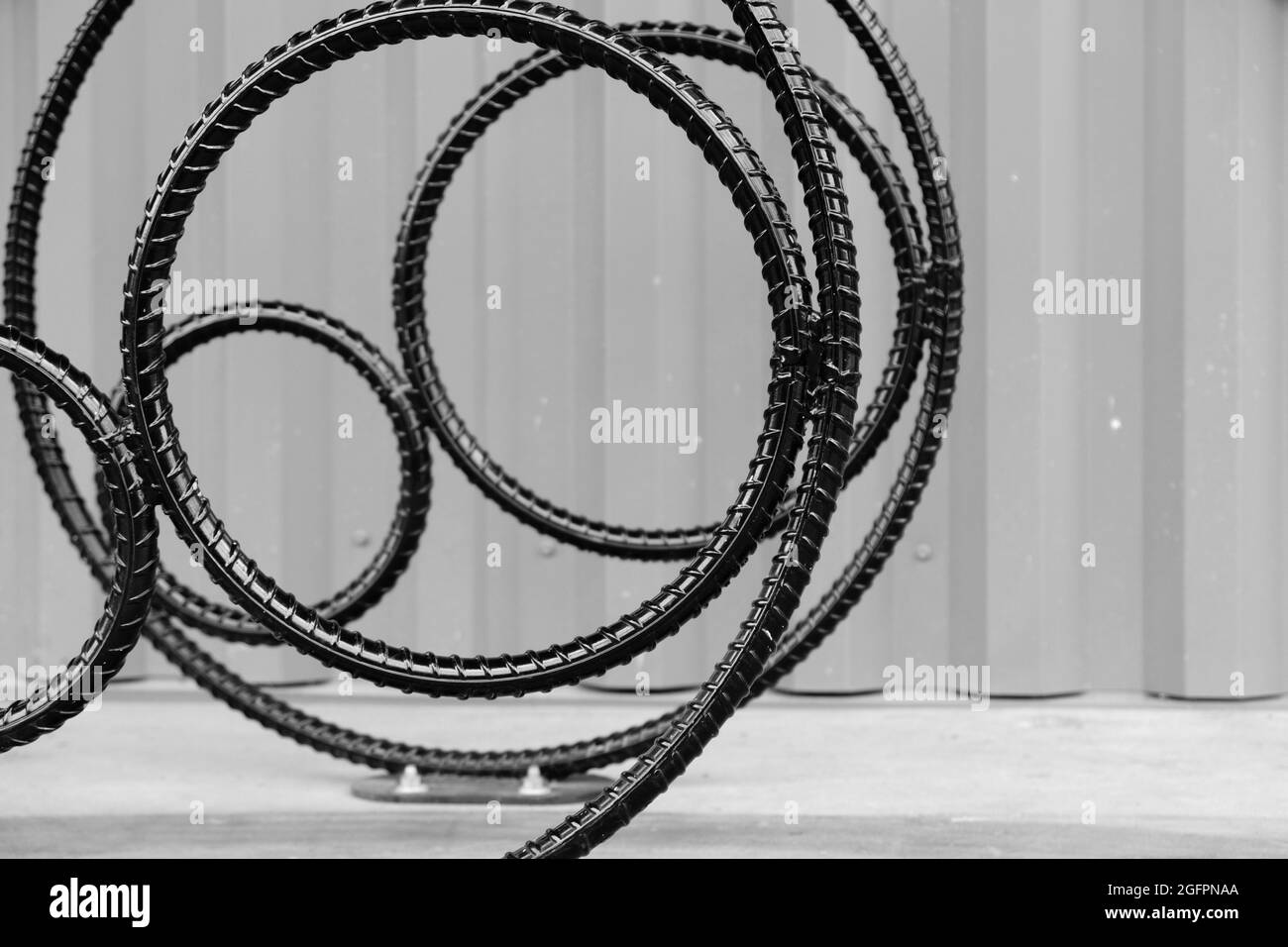 Iron rebar formed into abstract urban bicycle rack in monochrome Stock ...