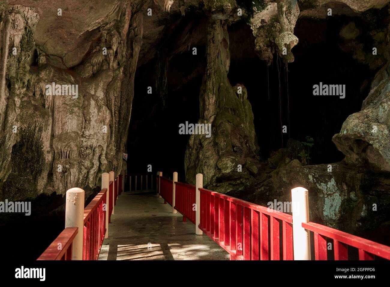 Old stone bat cave in the rock. Tourist attraction. Walk in the cave ...