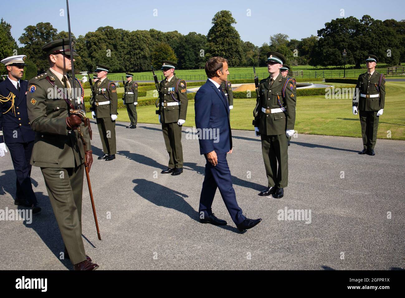 French President Emmanuel Macron review the Irish troops at Aras an ...
