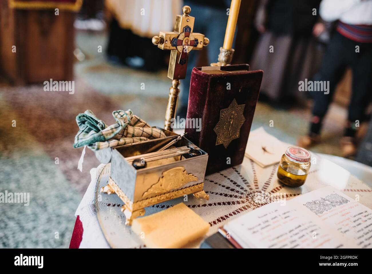 Selective focus of church paraphernalia, anointing oil, cross, Holy ...