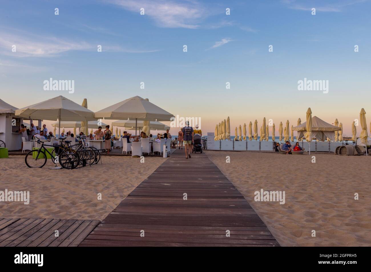 SOPOT, POLAND - Jun 20, 2021: A wooden pathway to a cafe with canopies ...
