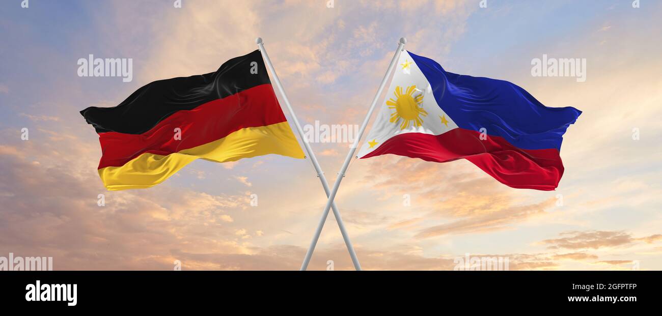 flags of Germany and Philippines waving in the wind on flagpoles ...