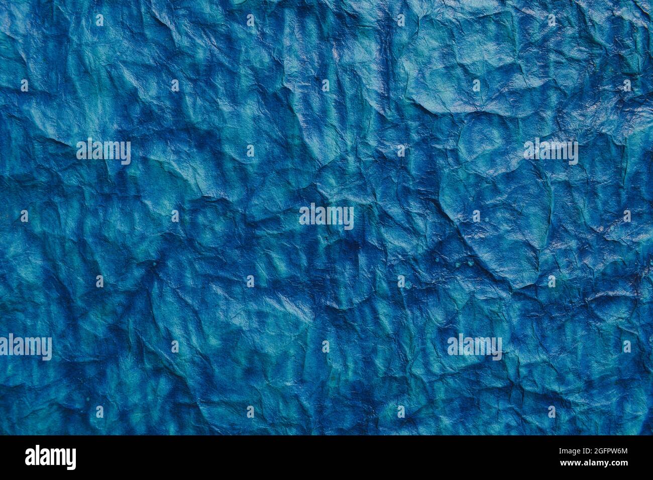 Blue textured chart paper background. Shades of blue in crumpled aged ...