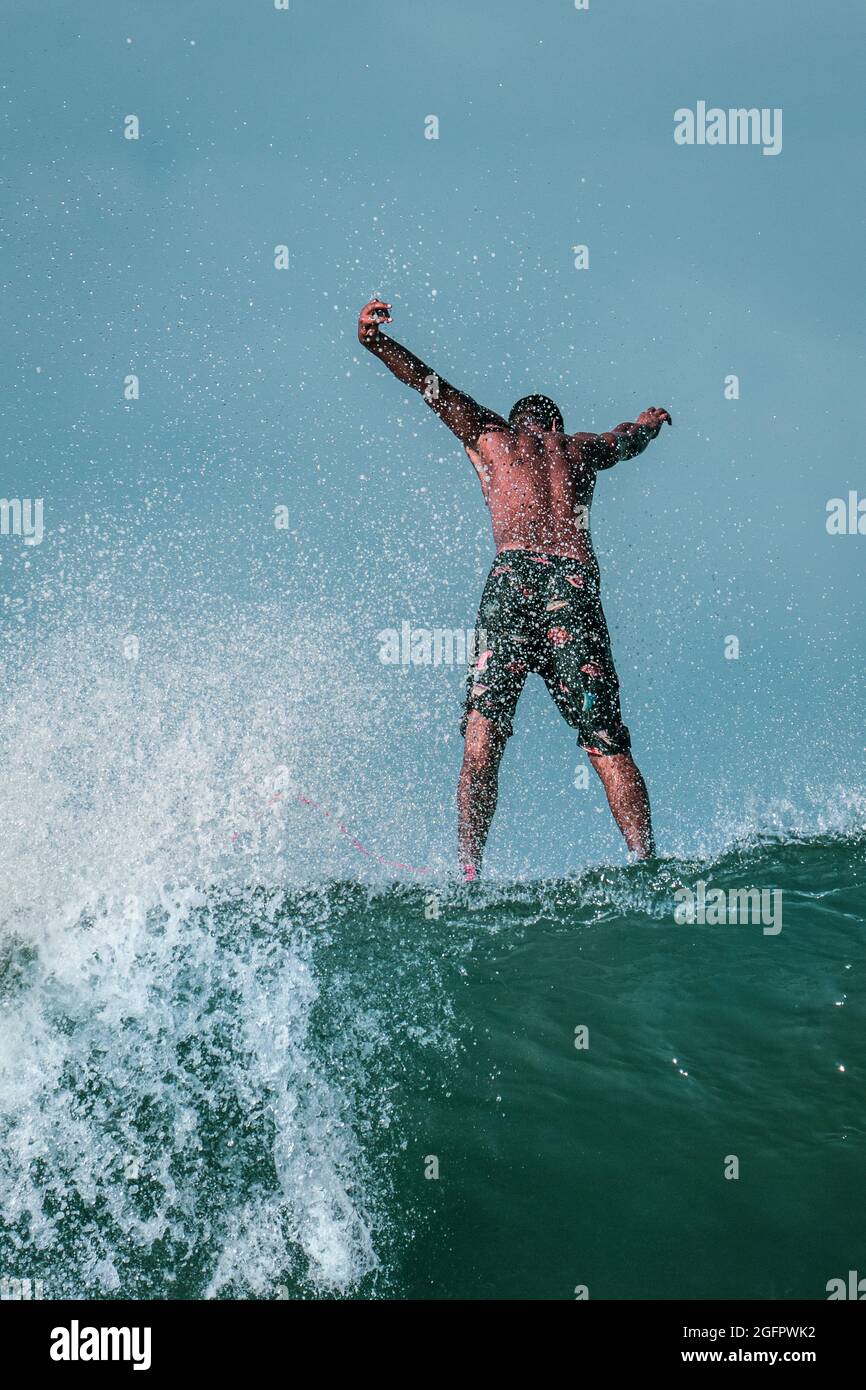 A skilled professional surfer appears to stand on the water when they ...