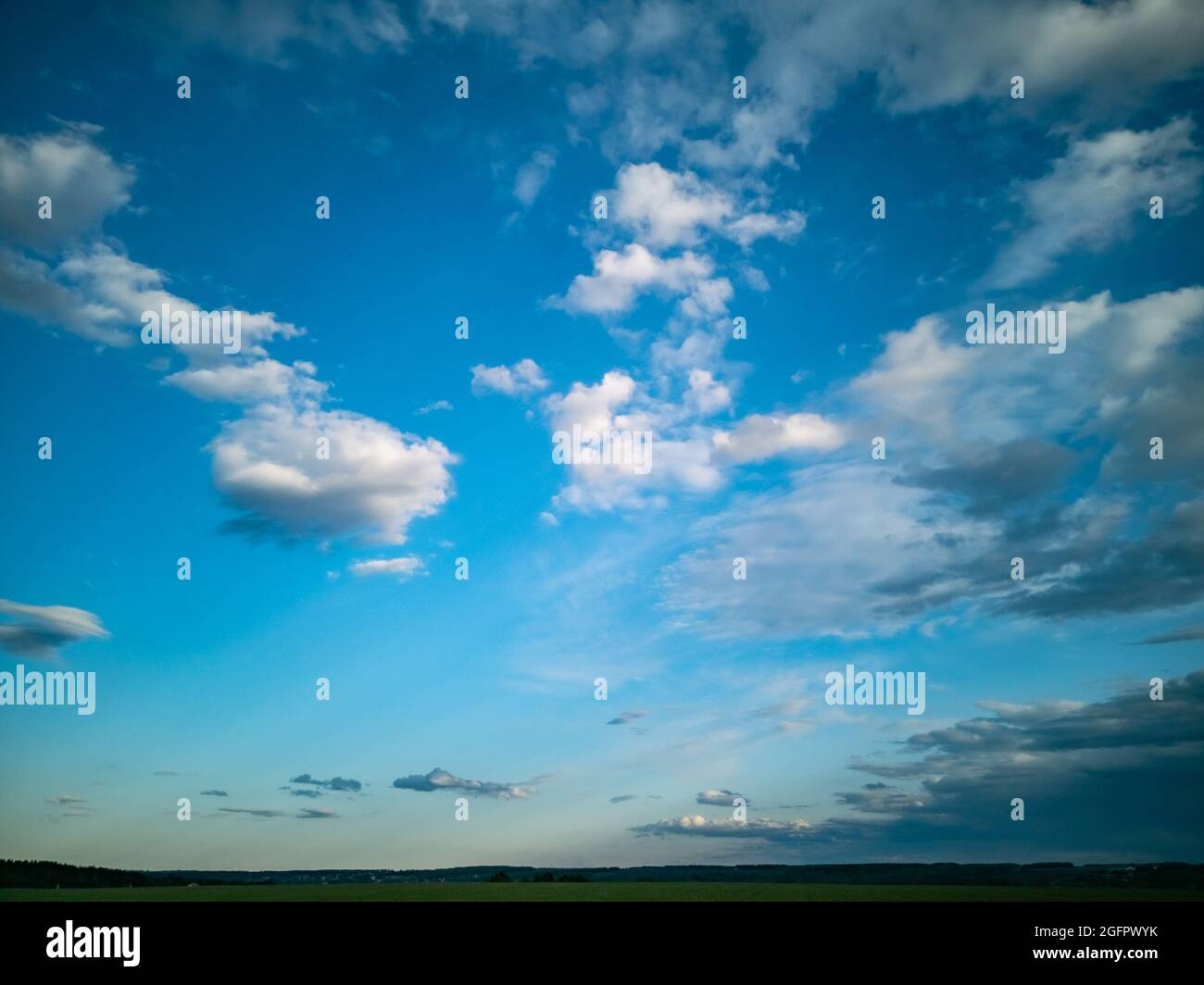 beautiful countryside landscape. deep blue sky with white clouds in ...