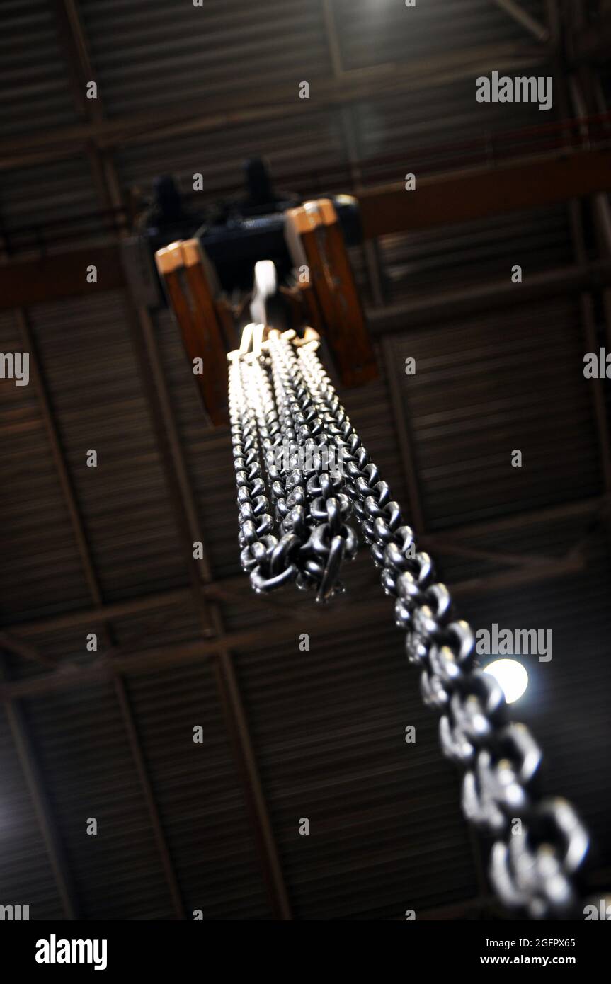 Chain hoist. Chain slings suspended from a crane hook. Industry Stock ...