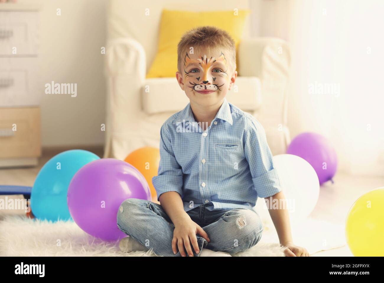 Funny boy with face painting in his room Stock Photo - Alamy
