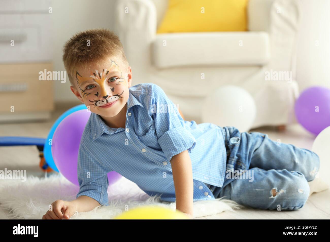 Funny boy with face painting in his room Stock Photo - Alamy