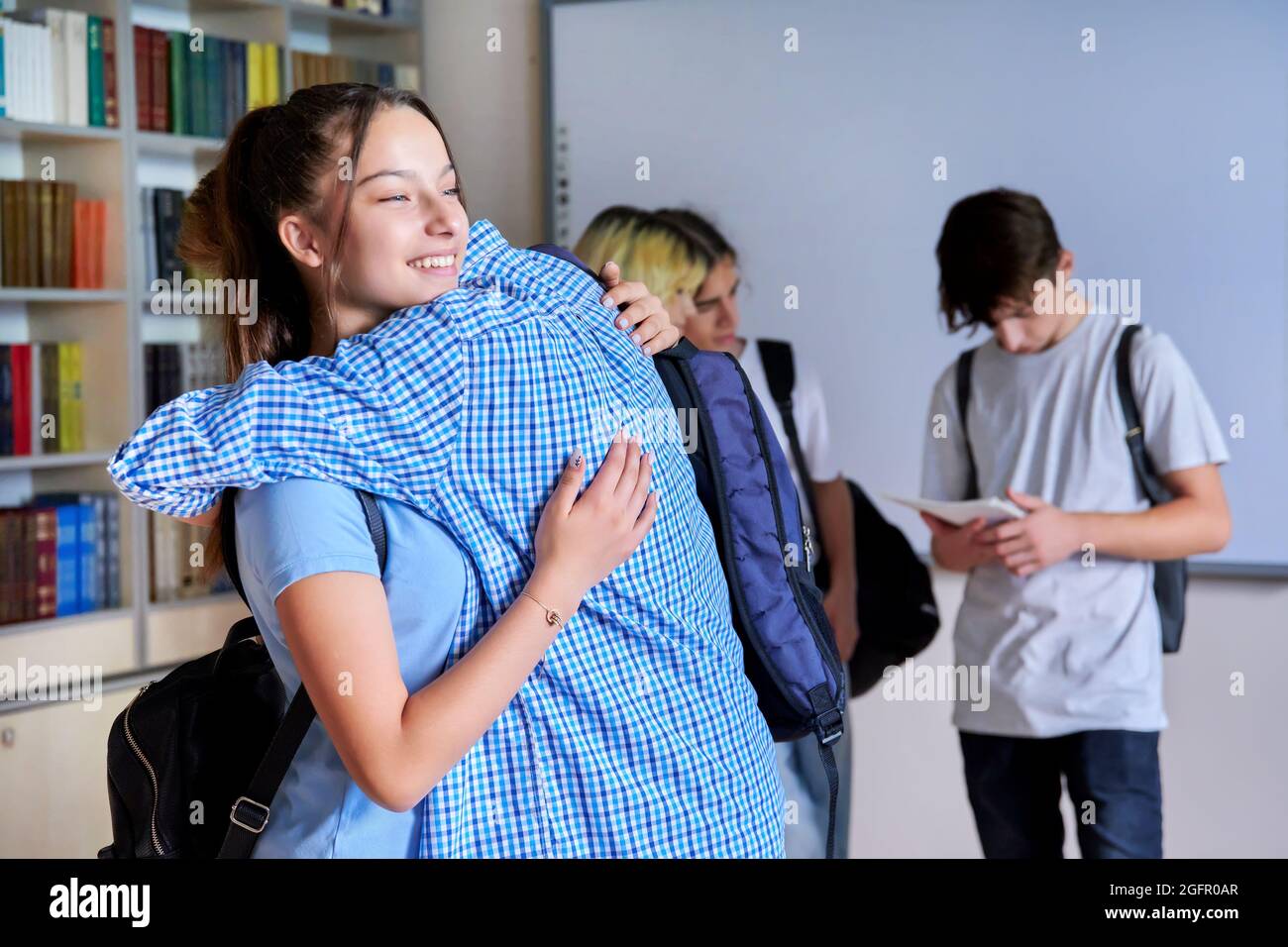 Group of teenagers guys and girls are welcome, meeting, smiling ...