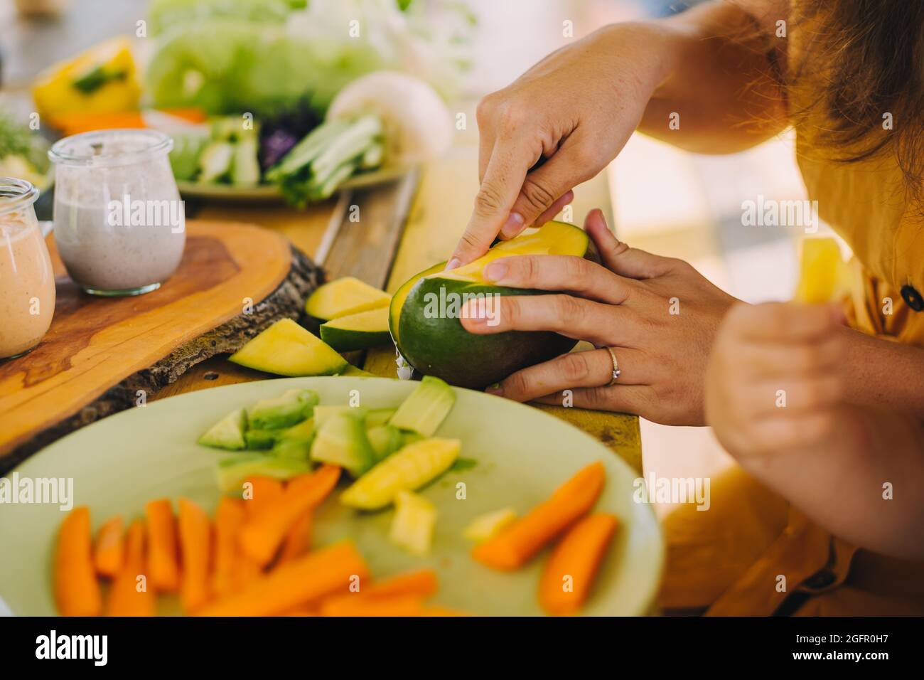 photo of woman preparing a mango Stock Photo - Alamy