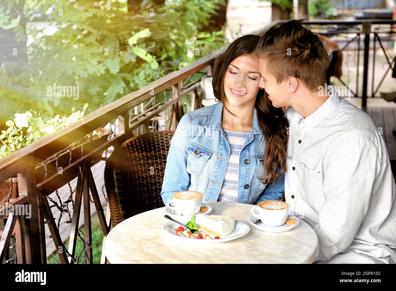 Young couple having date in cafe Stock Photo - Alamy
