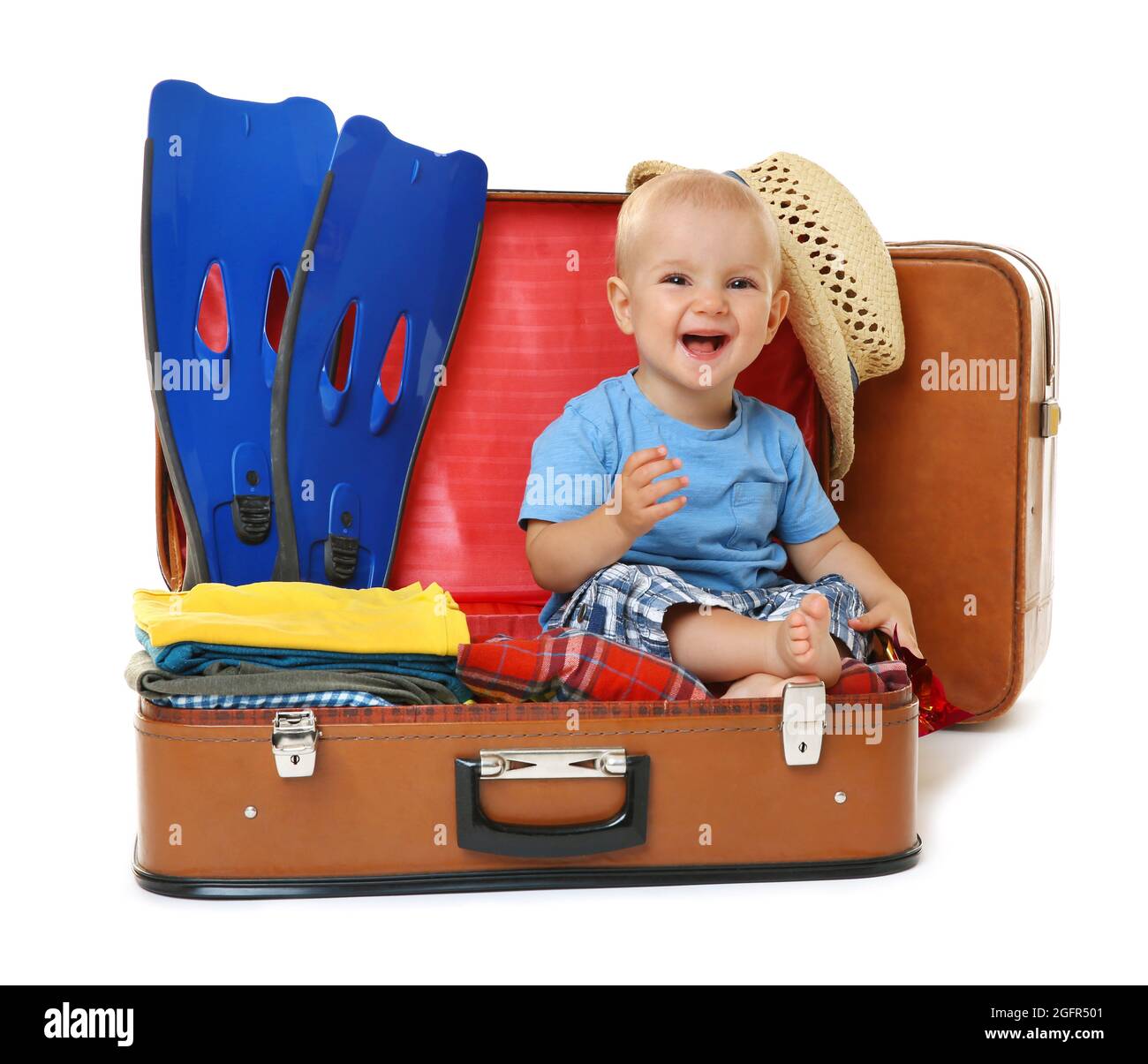 Baby sitting in suitcase on white background Stock Photo - Alamy