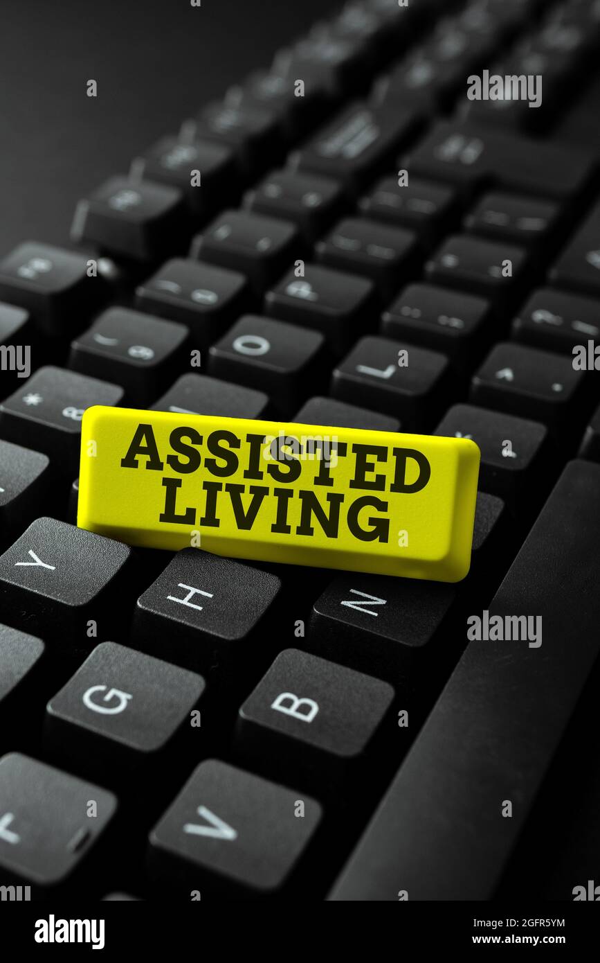 Hand writing sign Assisted Living. Word for longterm care facility for ...