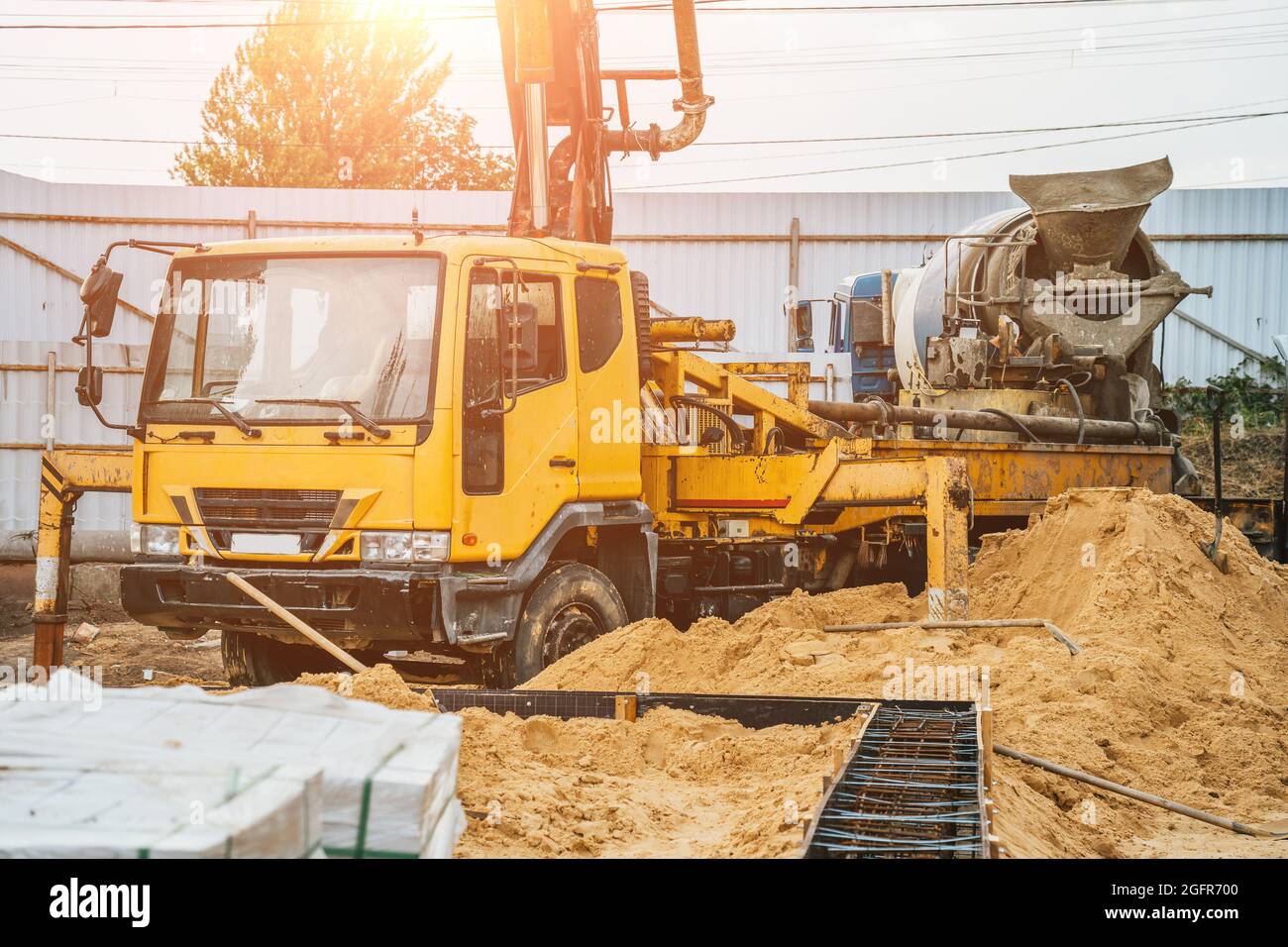 Cement feeding machine for pouring foundation on a construction site ...