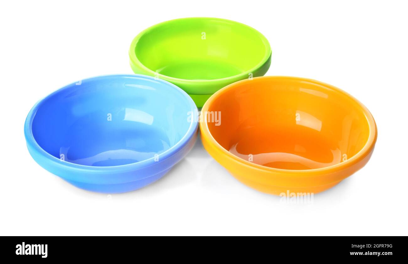 Colorful plastic plates for child on white background Stock Photo - Alamy