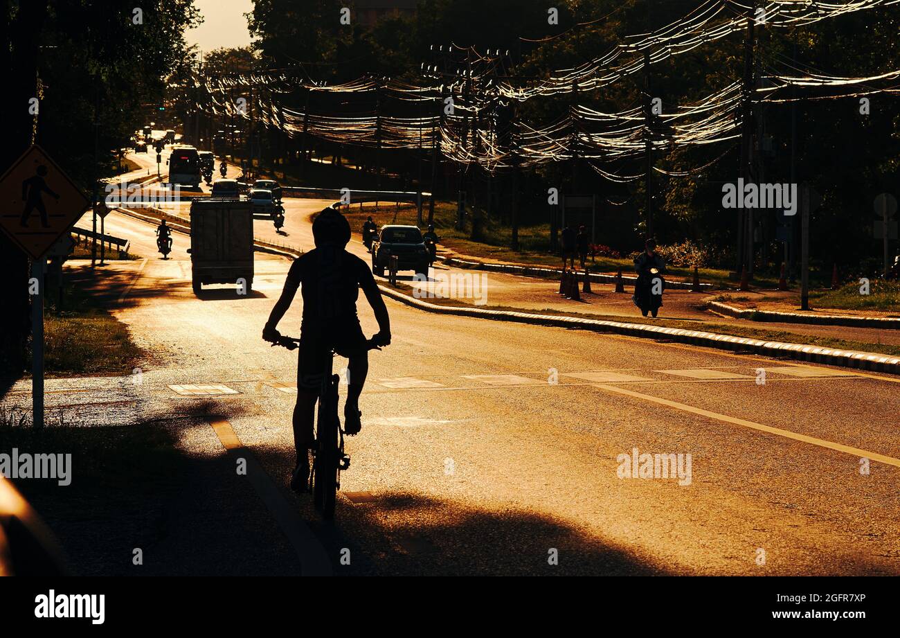 View of road and traffic in a backlit scene Stock Photo - Alamy