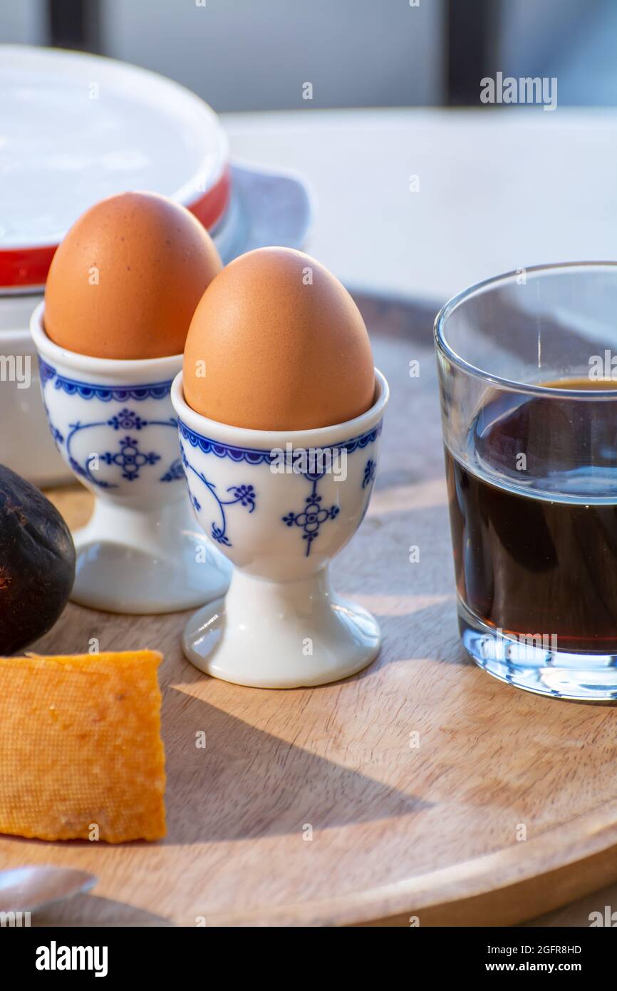 Continental breakfast with soft-boiled chicken egg served outdoor in ...