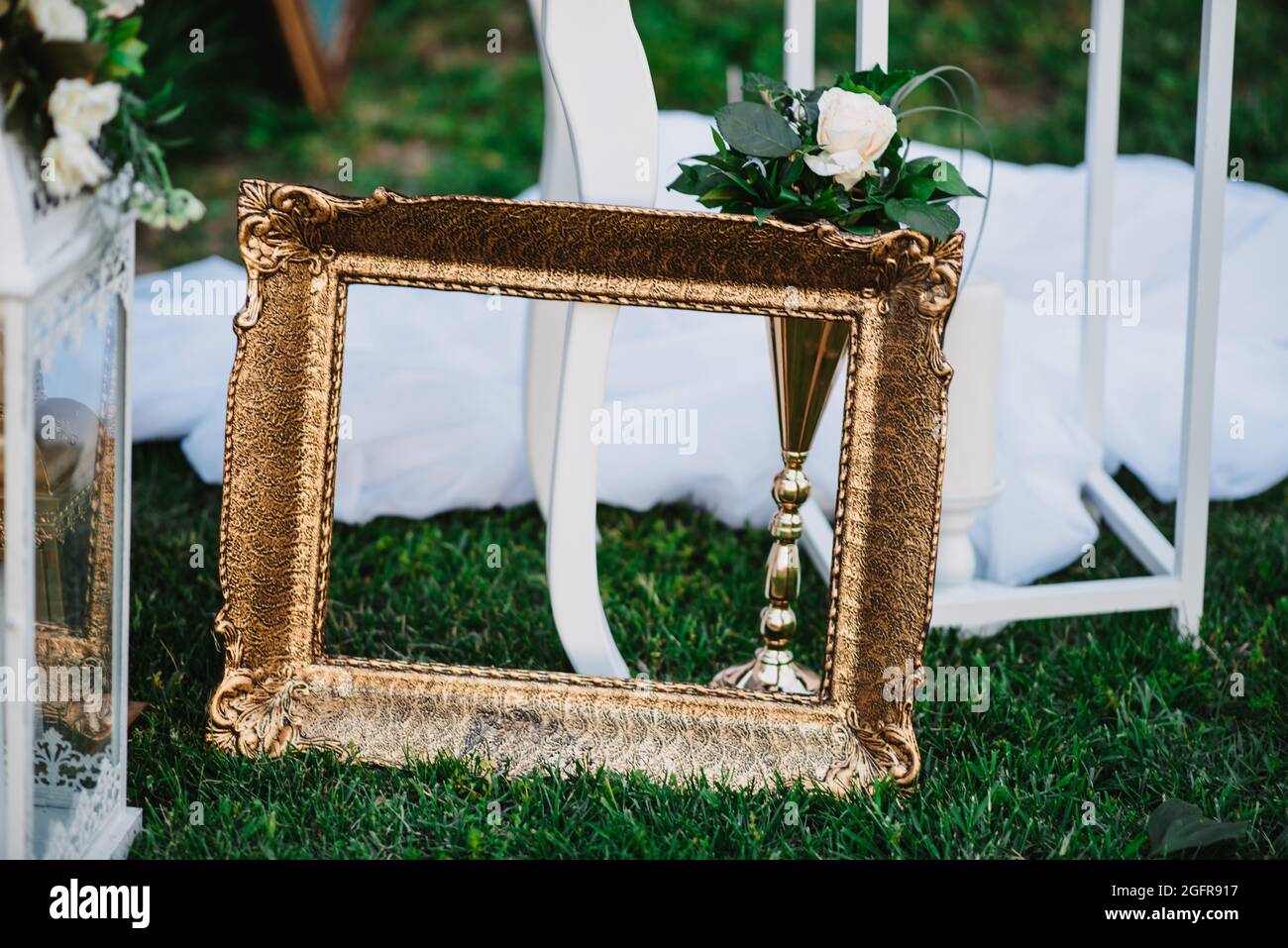 Decorative painting frame on the grass during the wedding ceremony ...