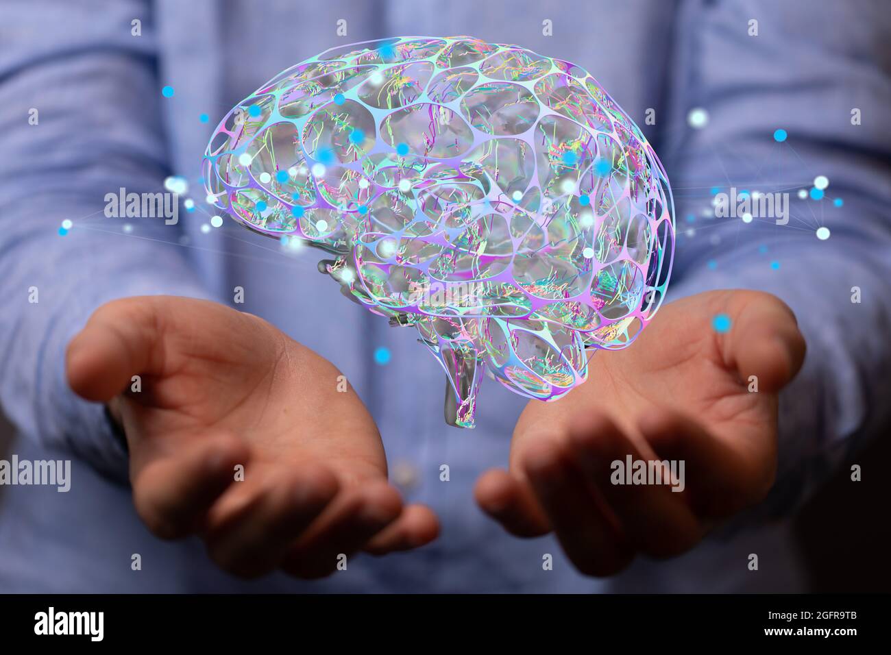 Person presenting the virtual projection of the human brain surrounded ...