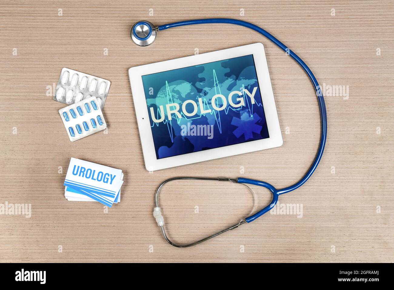 Tablet computer, stethoscope, medicines and cards on wooden background ...