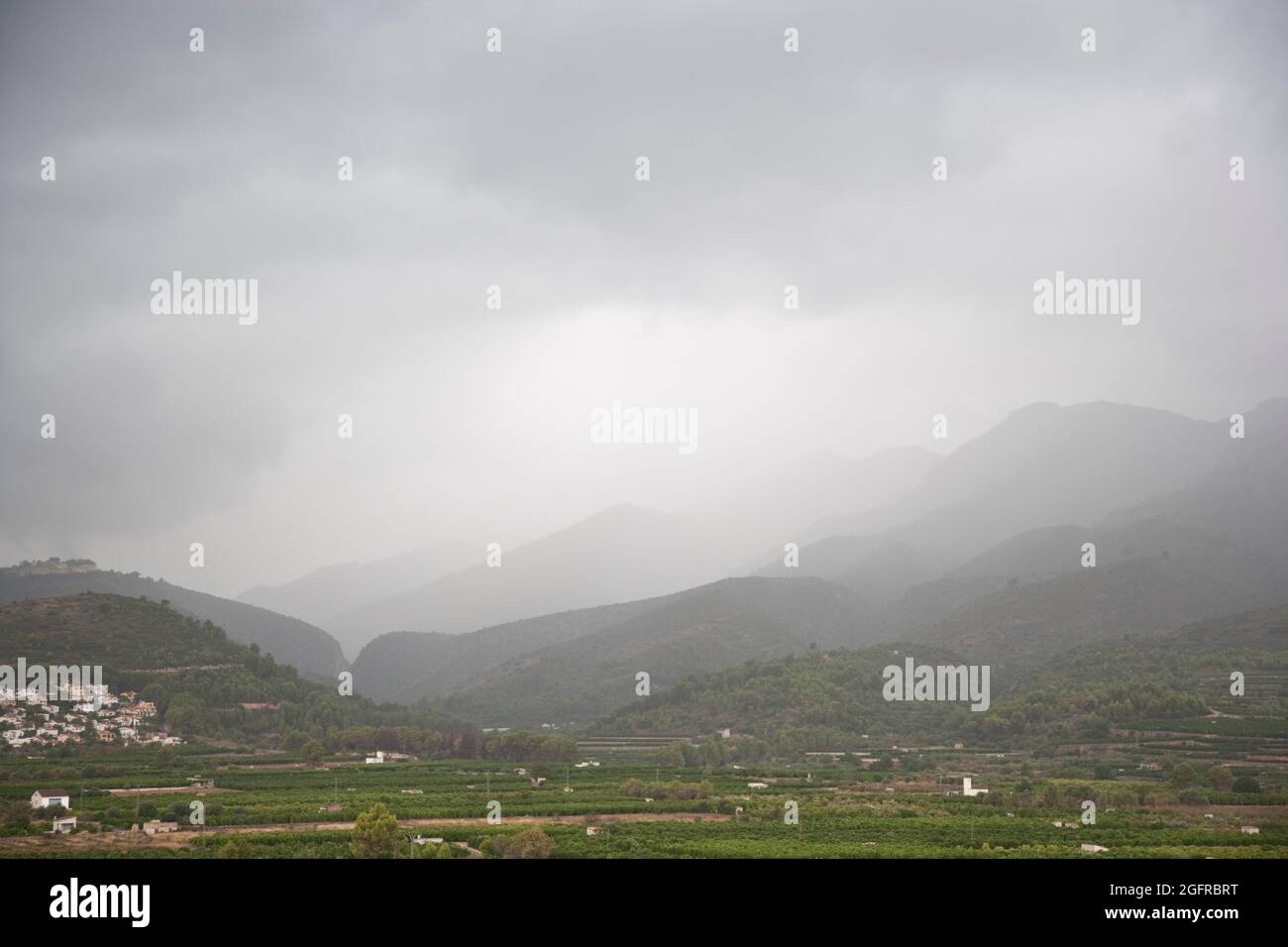 Mist and low cloud around mountains in summer, near Orba, Alicante ...