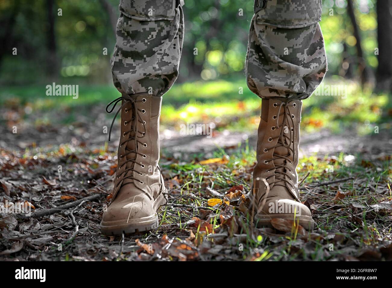 Feet of soldier standing in forest, close up view Stock Photo - Alamy