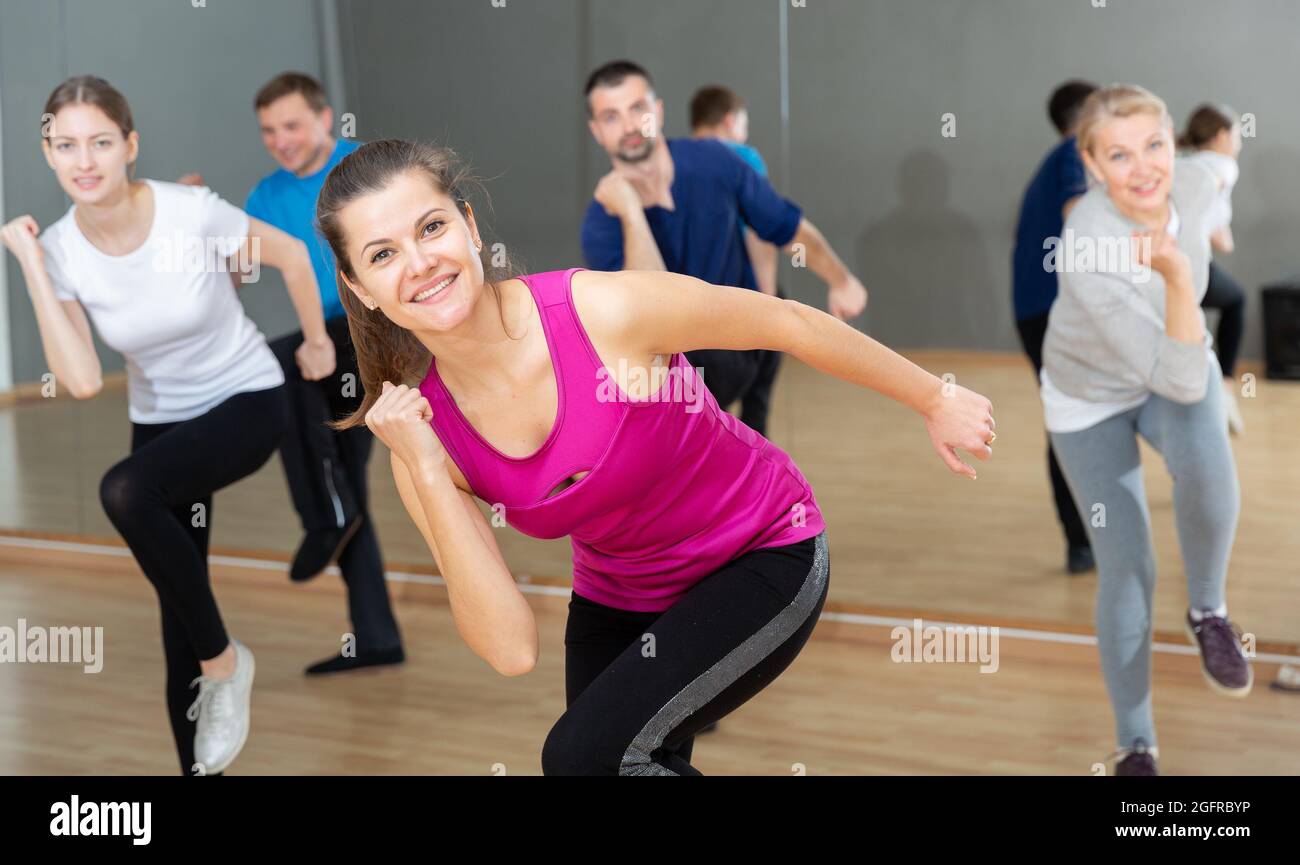Woman training at group dance class Stock Photo - Alamy