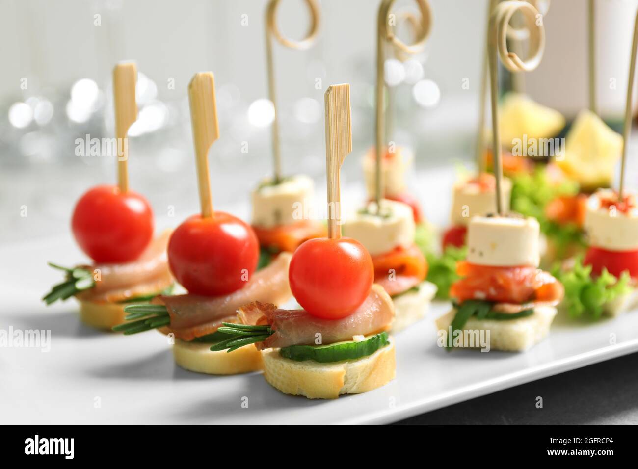 Assorted canapes on table closeup Stock Photo - Alamy