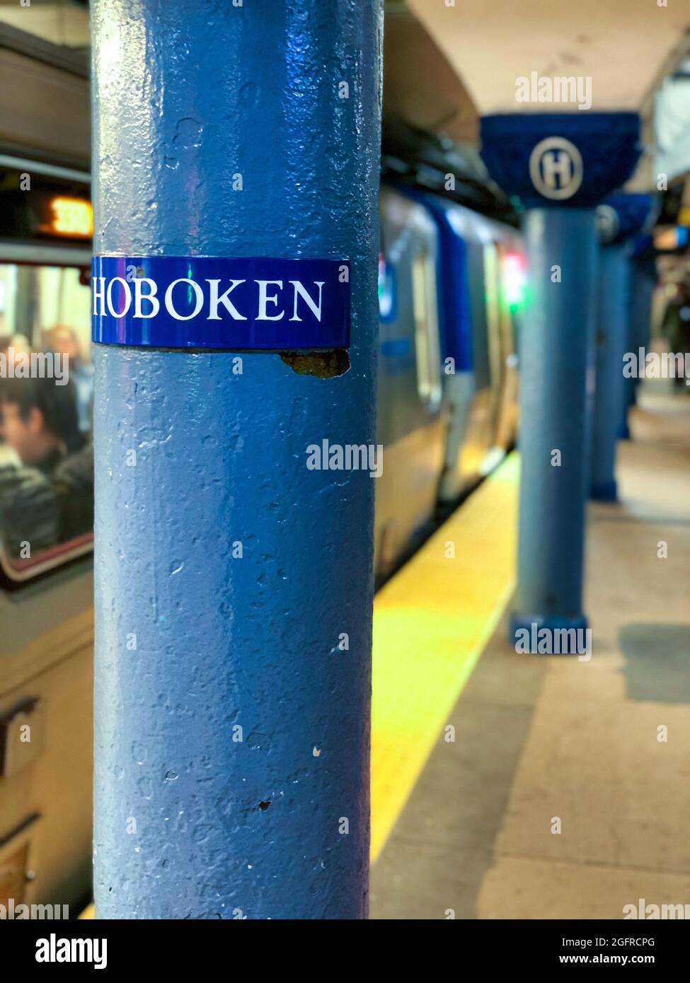 Selective shot of a blue column in Hoboken train station, New York City ...