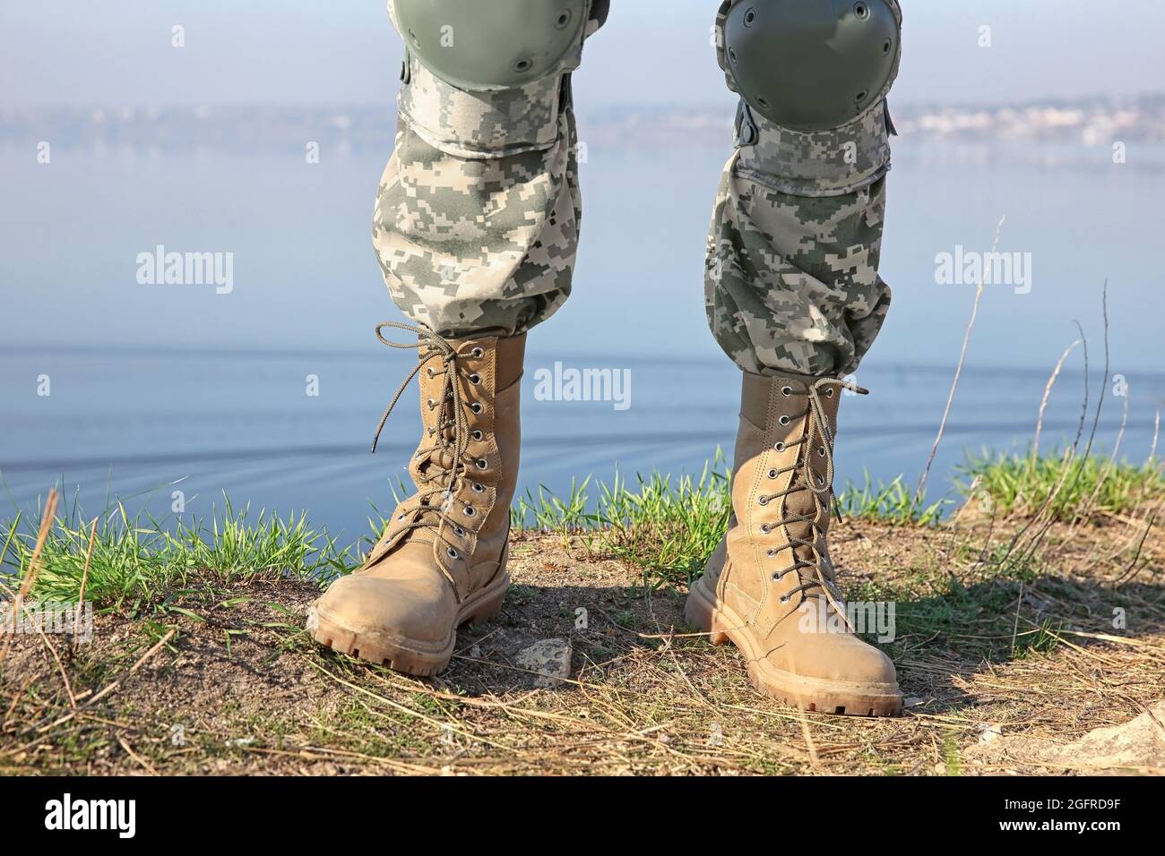 Legs of soldier standing near river, close up view Stock Photo - Alamy