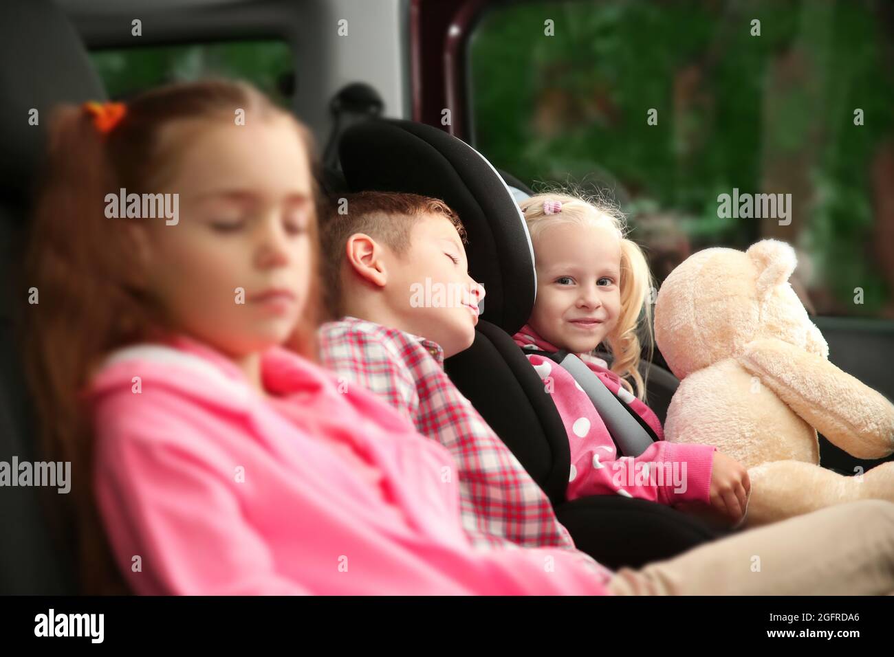 Cute children sleeping in a car Stock Photo - Alamy