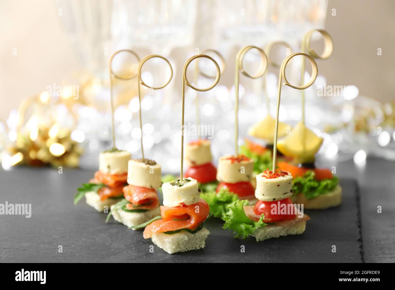 Assorted canapes on table closeup Stock Photo - Alamy