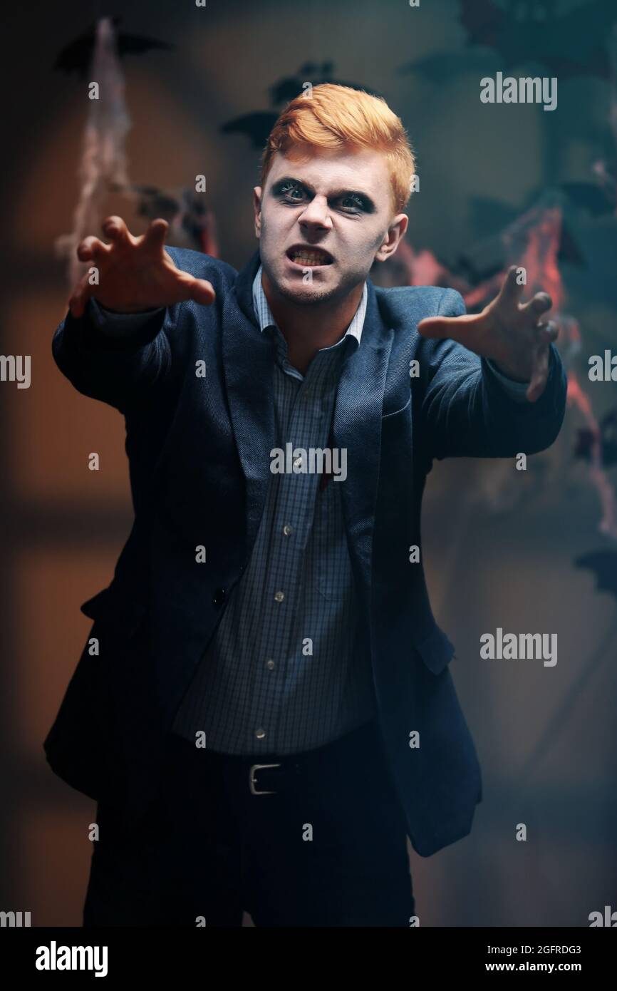 Guy dressed in dead man costume for Halloween, on dark background Stock ...