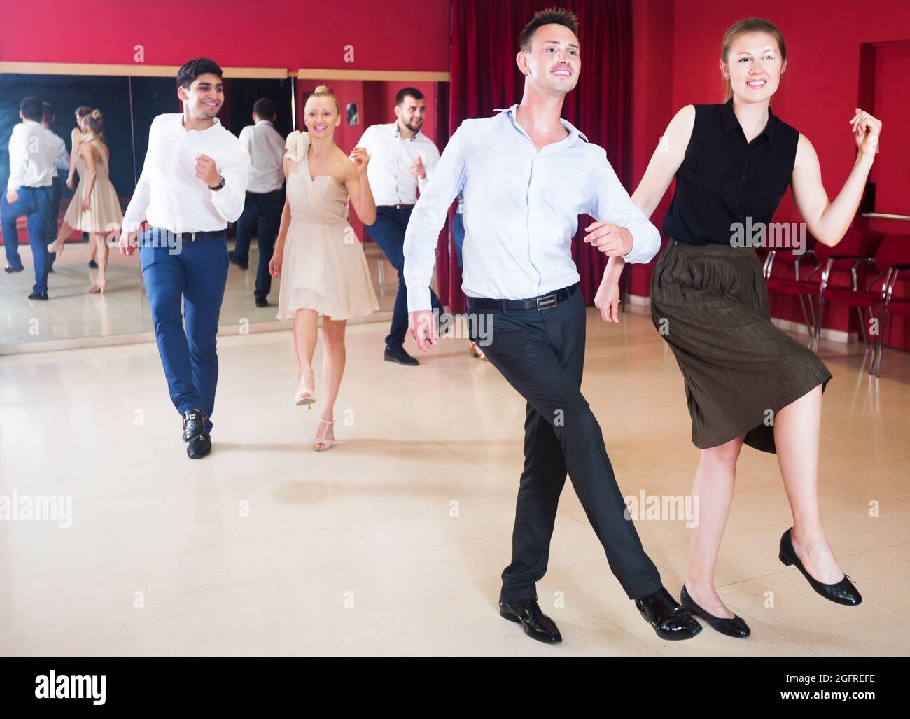 Couples enjoying active boogie-woogie Stock Photo - Alamy